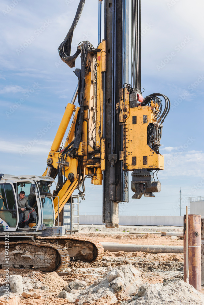 Hydraulic drilling machine at the construction site. Pile field. Modern ...