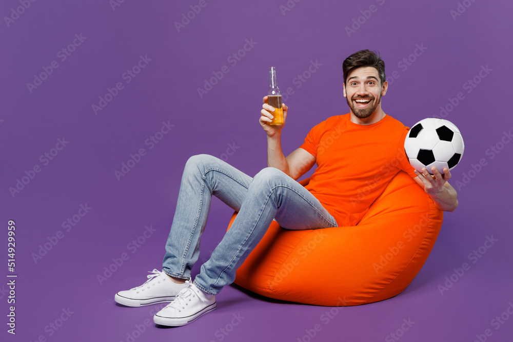 Full body excited young fan man he wear orange t-shirt cheer up support ...