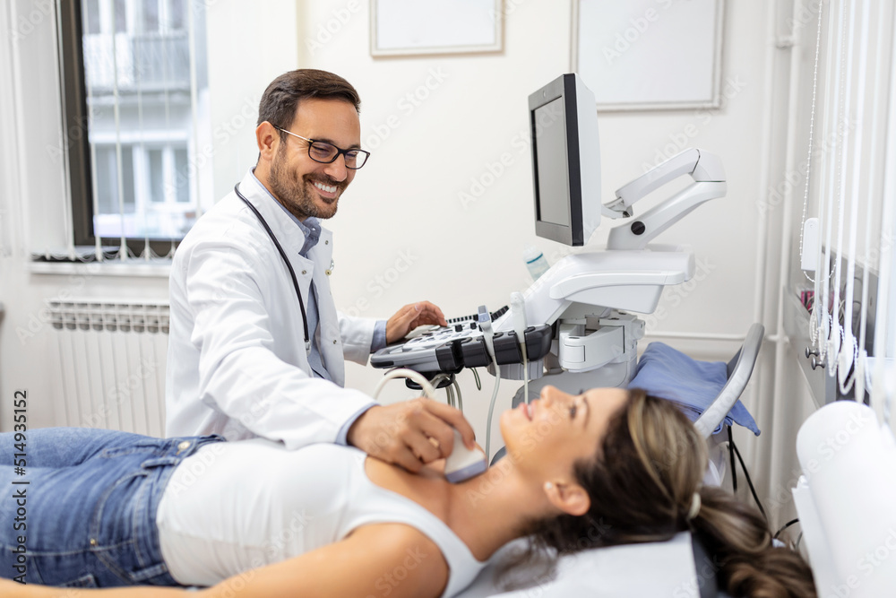 Ultrasound scanning diagnostic of woman thyroid gland in clinic, doctor ...