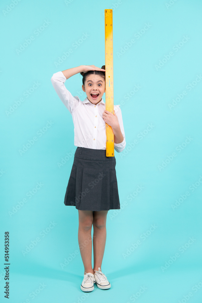 Kid height measure, growth measurement. Schoolgirl in school uniform ...