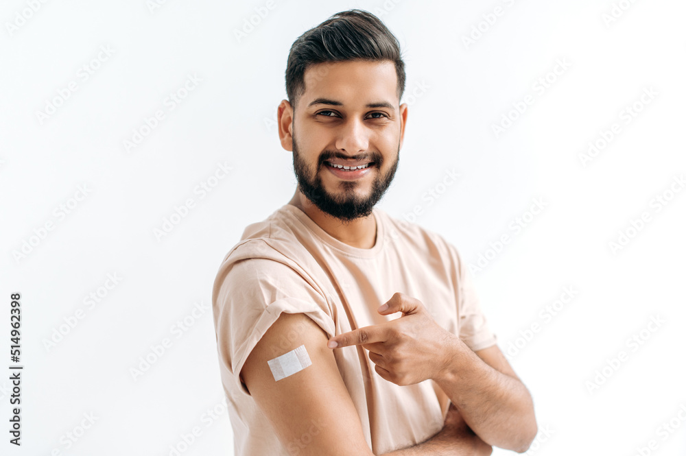 Vaccination concept. Young indian or arabian man getting a vaccine ...