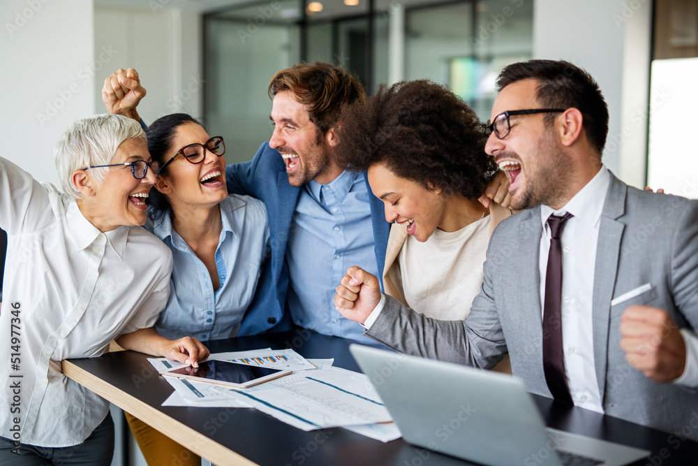 Happy group of business team celebrating a good job in the office ...