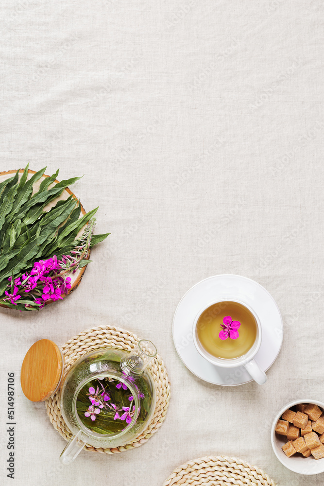 Herbal tea from kipreya leaves in white cups on linen fabric table ...