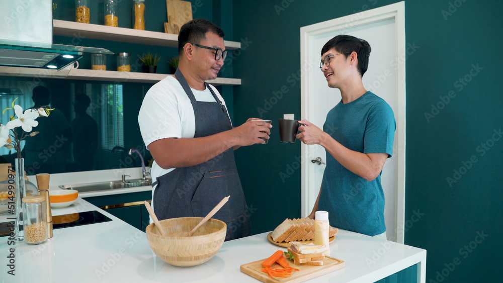 Two couples, standing to eat sandwiches, drinking coffee, working ...