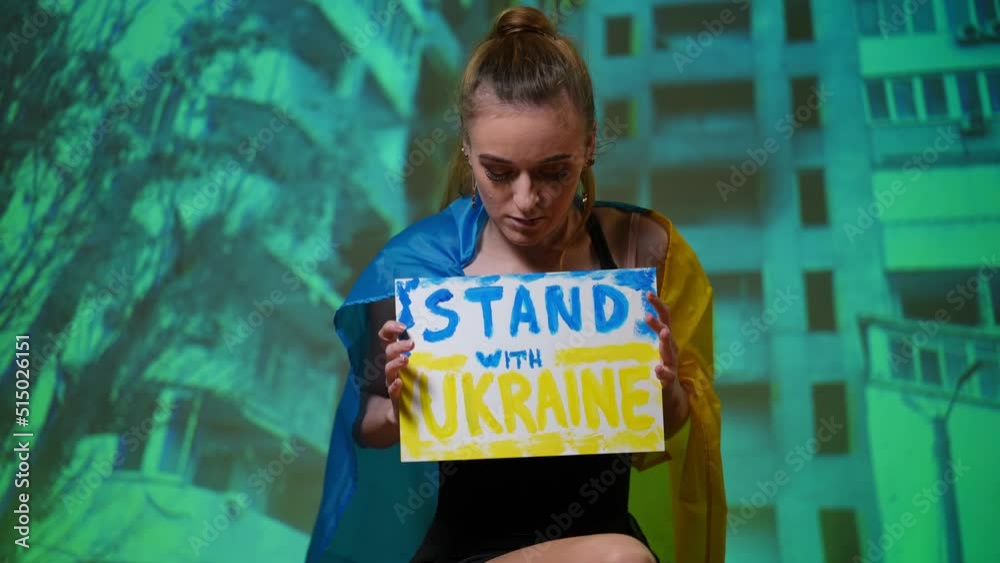 Front view sad desperate Ukrainian woman showing Stand with Ukraine ...