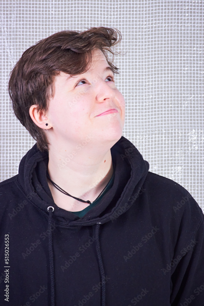 Natural portrait of young handsome transgender man posing with neutral ...