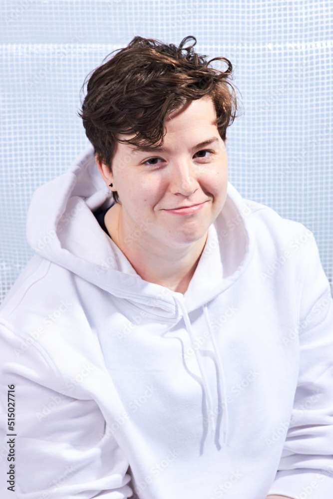 Natural portrait of young handsome transgender man posing with neutral ...