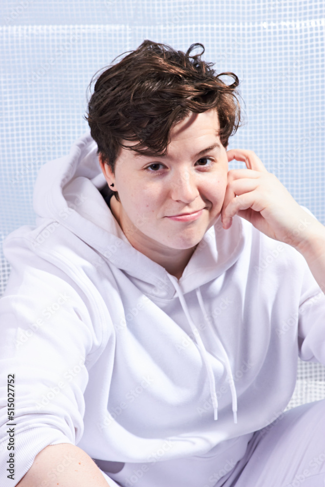 Natural portrait of young handsome transgender man posing with neutral ...