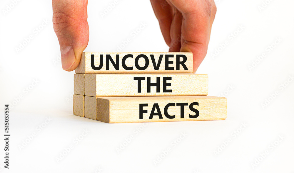 Uncover the facts symbol. Concept words Uncover the facts on wooden ...