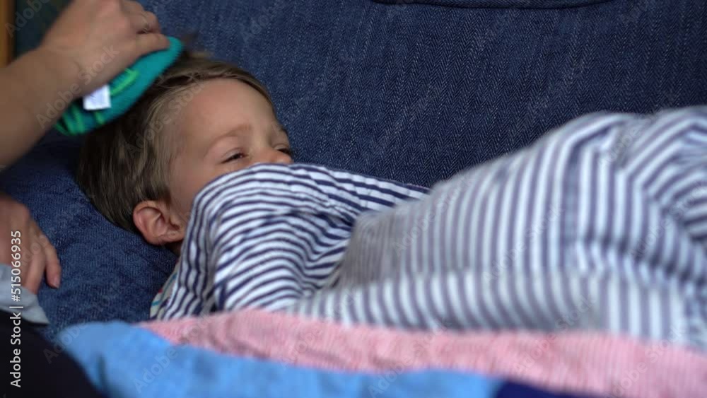 Portrait of sick ill little preschool child boy. Measuring body Hight ...