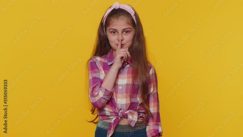 Shh be quiet please. Preteen child girl kid presses index finger to ...