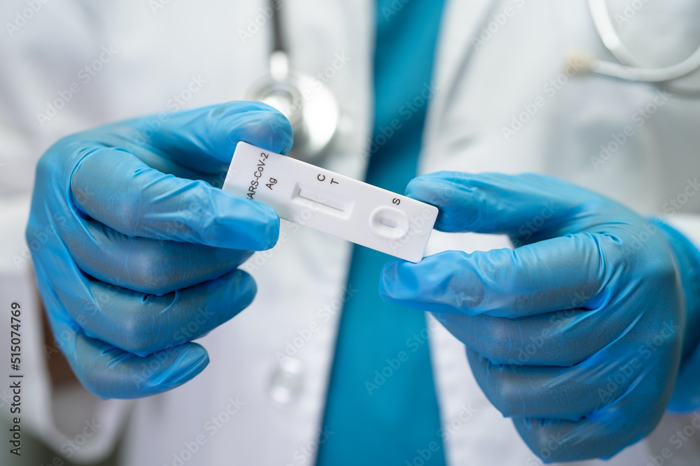 Asian doctor in PPE suit show positive test result with Saliva Antigen ...