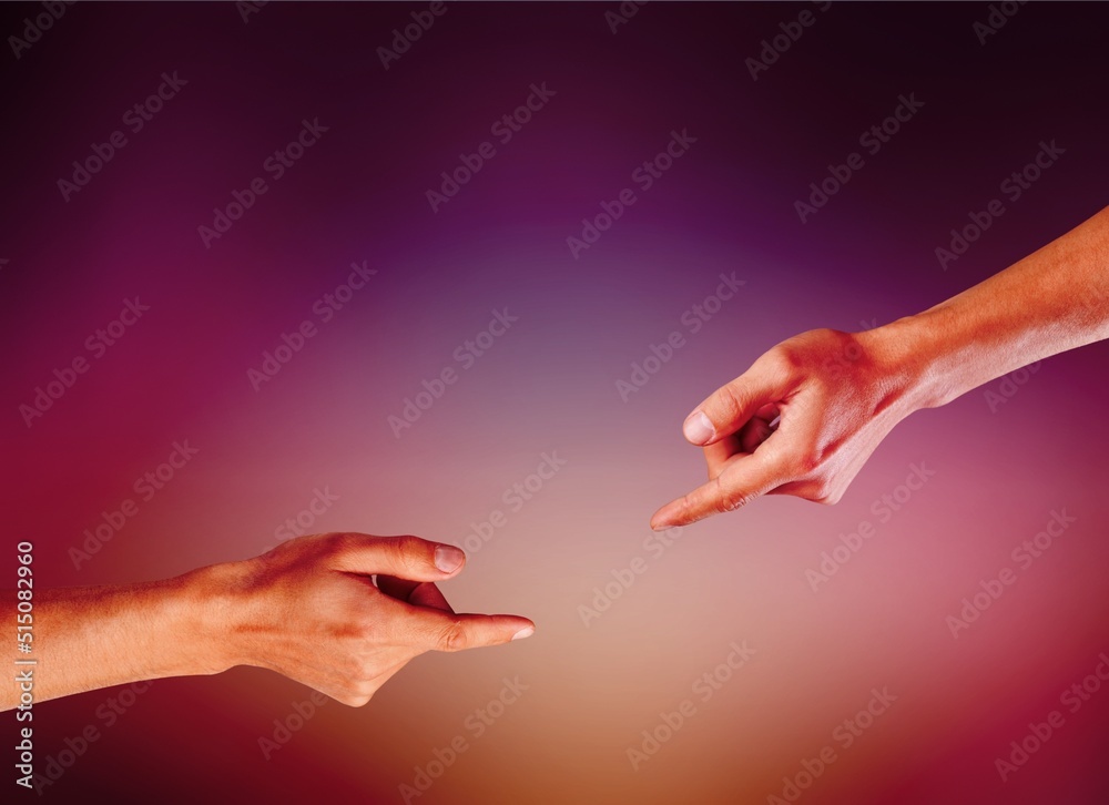Moment of weightless. Two human hands trying to touch each other on ...