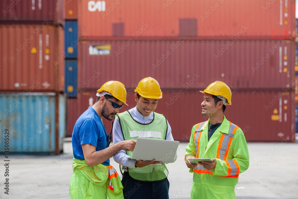 Manager standing and meeting with his staff in container depo company ...