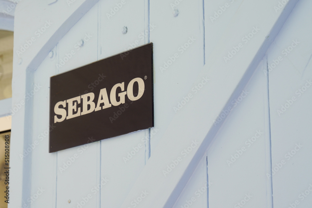 Sebago boutique brand logo and sign text on facade entrance fashion ...