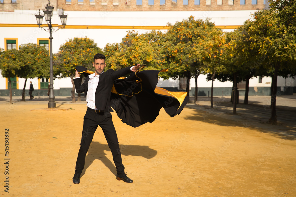 Young Spanish man in black shirt, jacket and pants, with dancing shoes ...