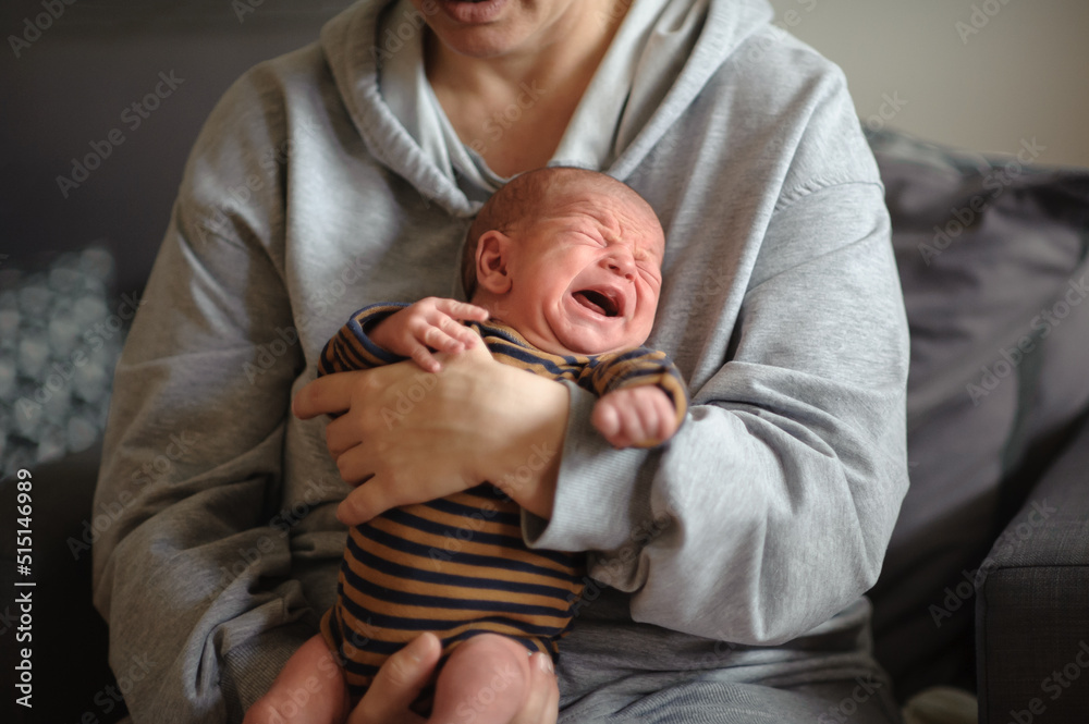 Foto de Sweet and cute small little newborn baby is hungry and upset ...