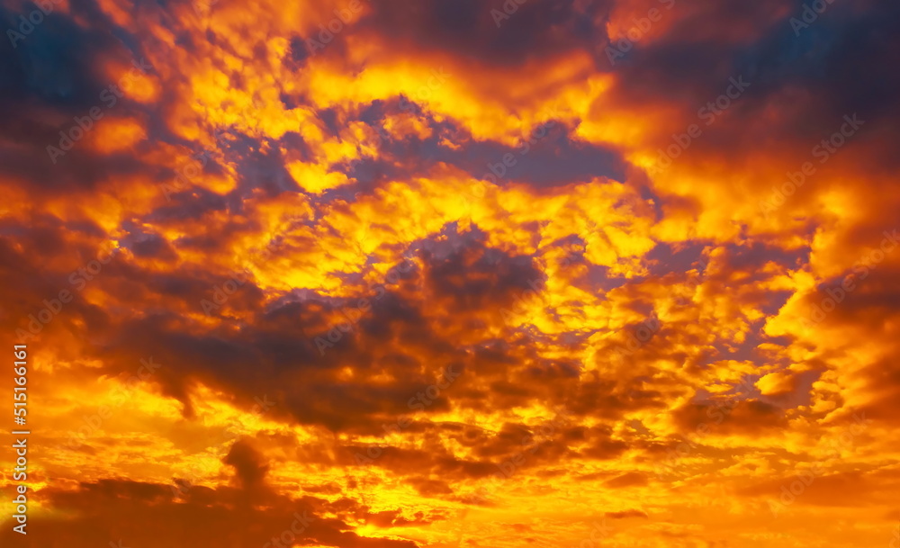 colorful dramatic sky with clouds, smoking cumulonimbus clouds reflect ...