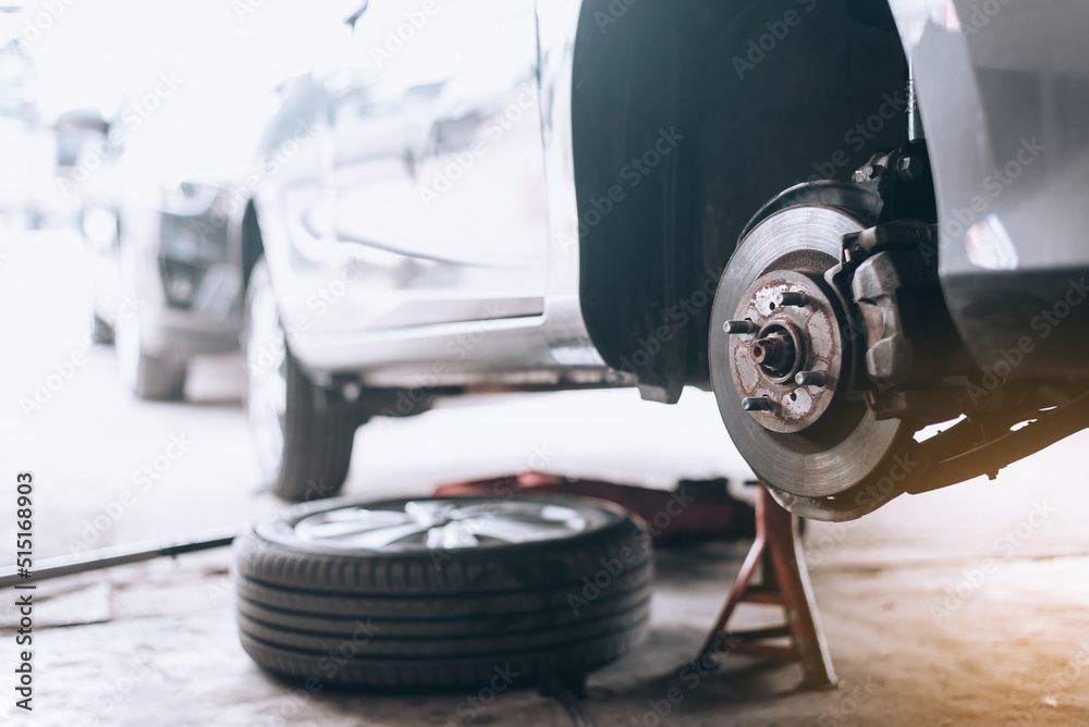 Repairing the breaks of a car after a street crash. Details and focus ...