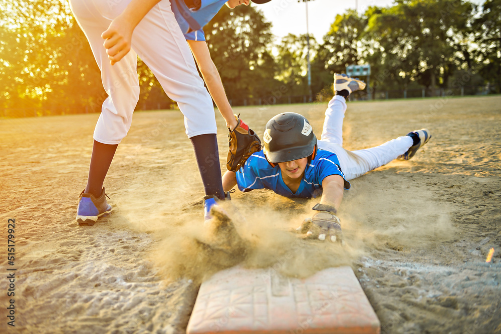 Group of two baseball players play together on the playground. On of ...