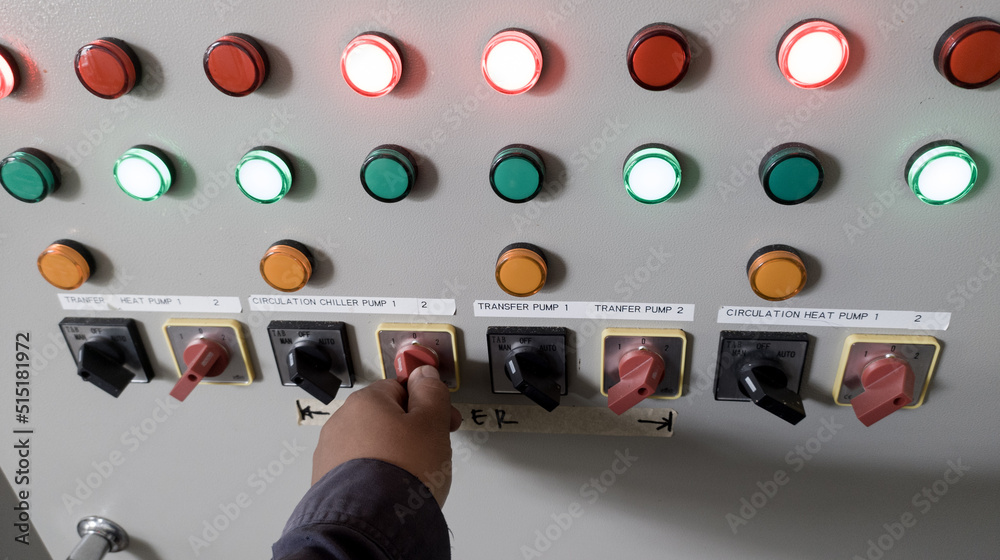 an electrician is operating the engine controller on the electric power ...