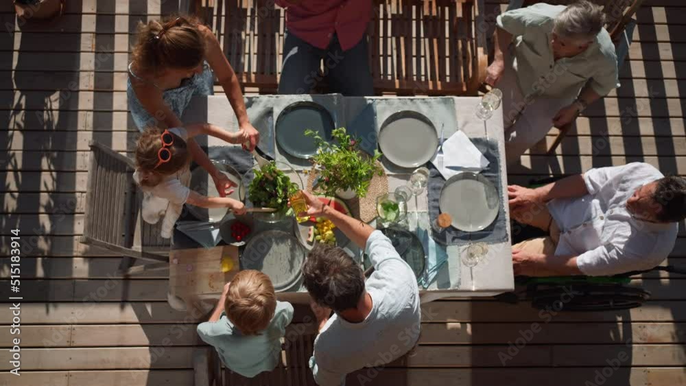 Top view of 3 generations family eating at barbecue party dinner on ...