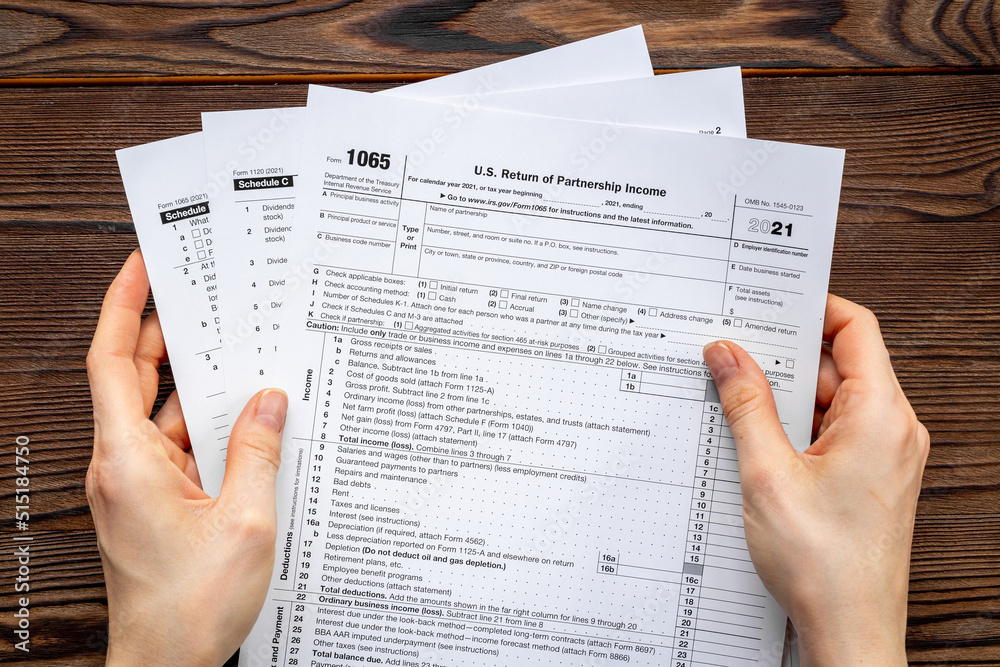 Accountant culculate taxes - US tax form on office table desktop Stock ...