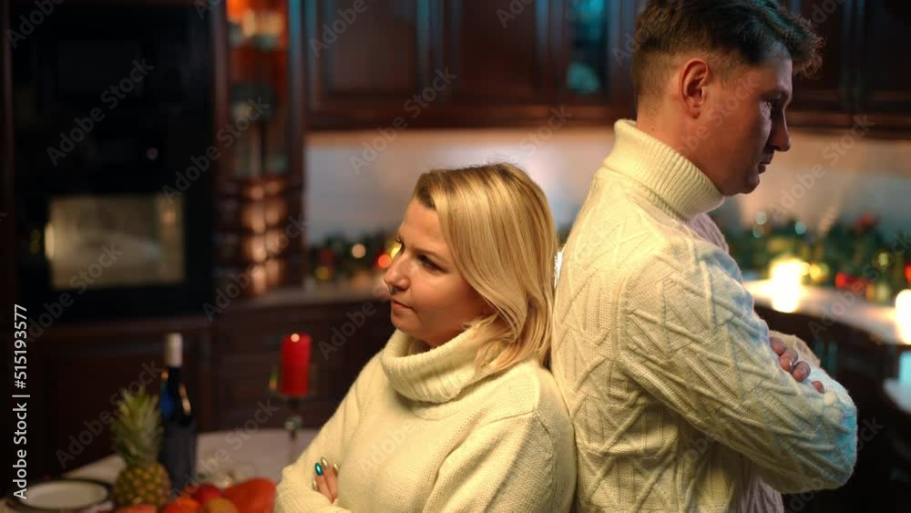Argued dissatisfied Caucasian couple standing back to back looking at ...