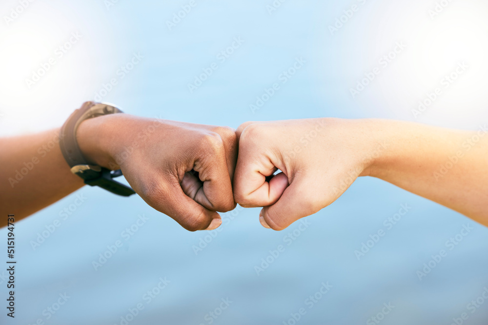 Female friends feeling supported, united and touching fists at the ...