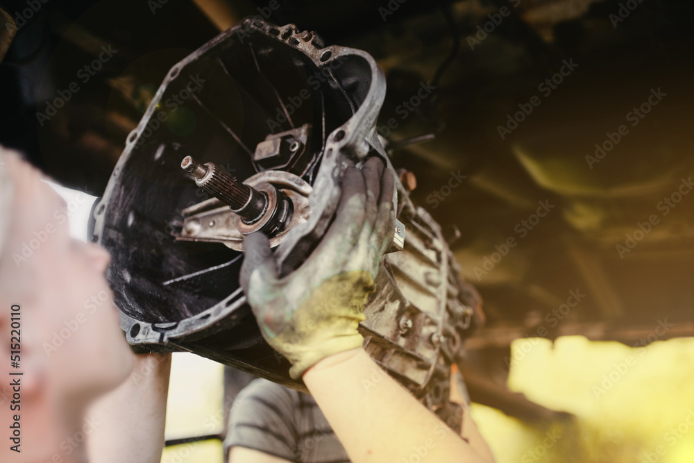 installation of a gearbox in a car in a car service. Stock Photo ...