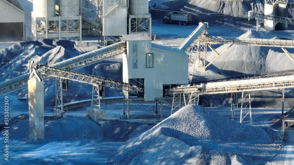 Limestone mine quarry. Elevator system transports rocks into piles for ...