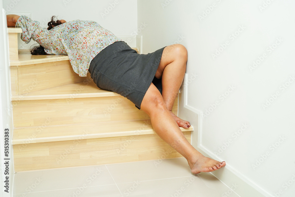 Asian lady woman injuries from falling down on slippery surfaces stairs ...