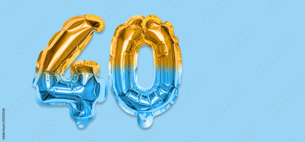 Rainbow foil balloon number, digit forty on a blue background. Birthday ...