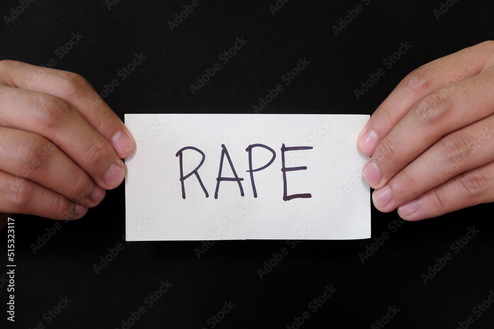 Rape case or sexual assault mug shot concept. Criminal hands holding ...