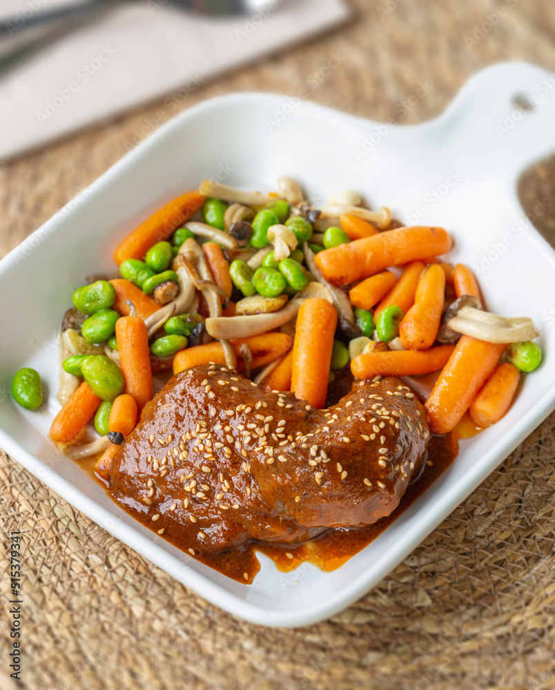 Roe deer tenderloin in sauce cooked at low temperature with sauteed ...