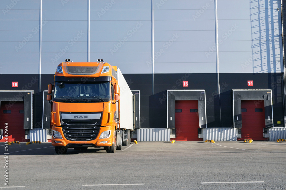 Modern logistics complex. Unloading trucks in a modern warehouse ...