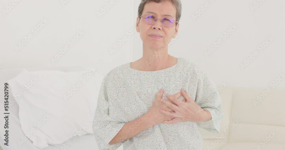 Unhappy old senior lady suffering from indigestion flatulence abdominal ...