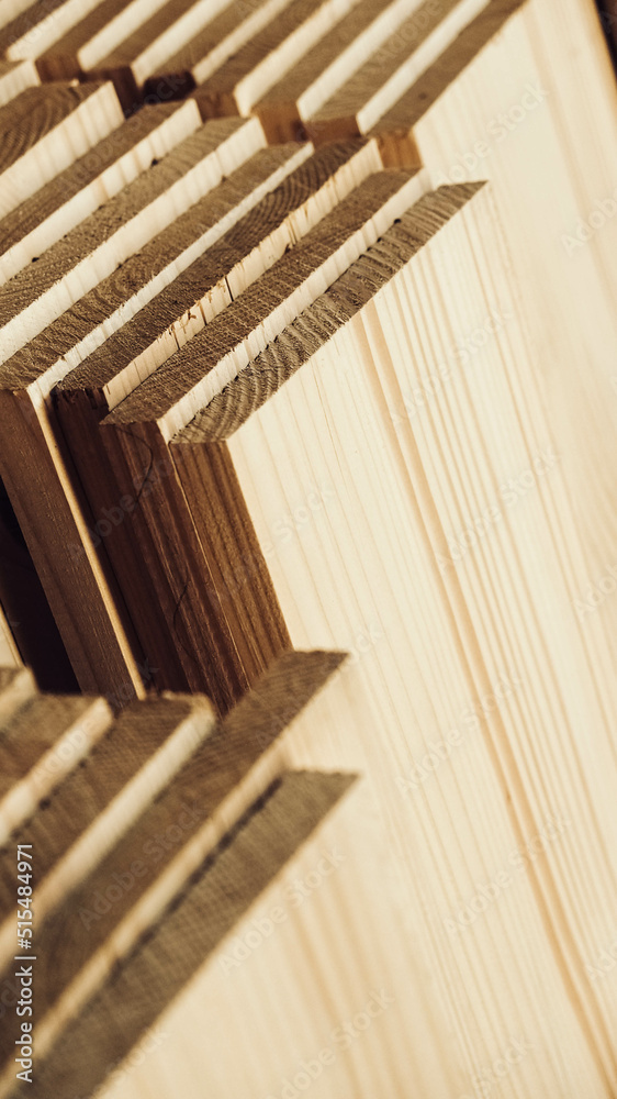 Stacked wooden carpentry boards from natural wood in a woodworking ...