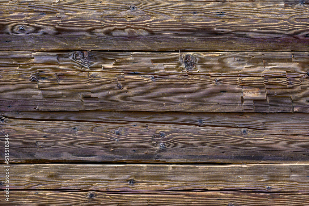 Wooden exterior of a rustic cabin built out of hand-hewn timber, as a ...