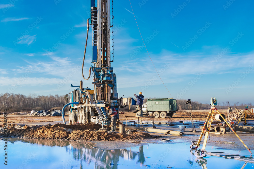 Close-up of a car-based drilling rig at a construction site. Drilling deep wells for mining ...