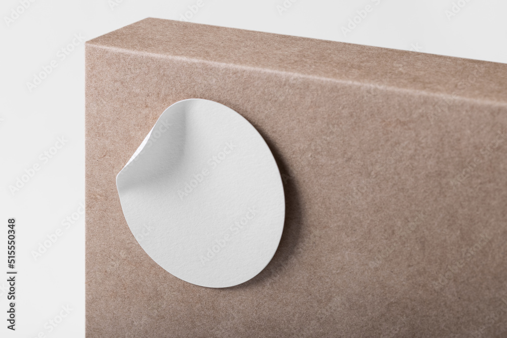 Rounded sticker mockup template on box package with copy space for your ...