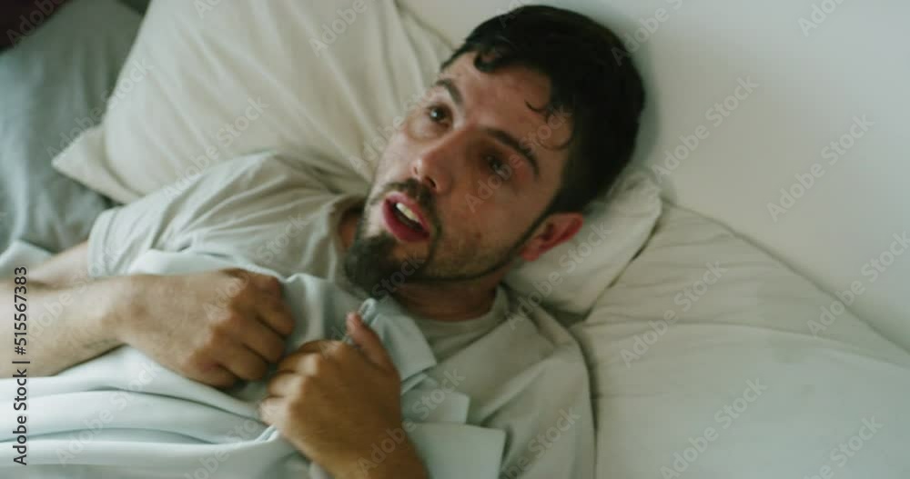 Stockvideo Restless insomniac feeling anxious while having a nightmare ...