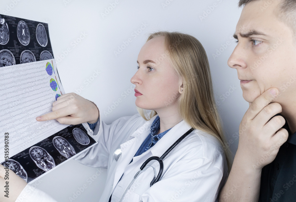 Epileptologist examines patient MRI and electroencephalogram. Concept ...