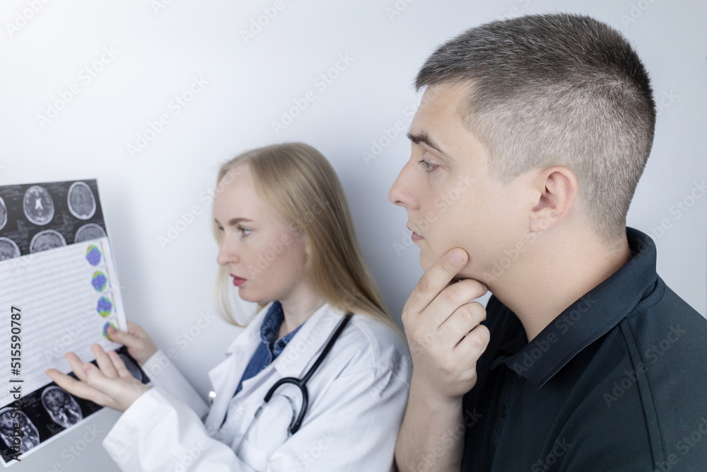 Epileptologist examines patient MRI and electroencephalogram. Concept ...