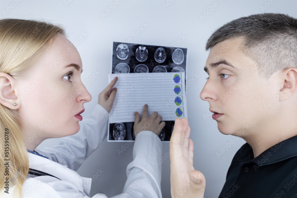 Epileptologist examines patient MRI and electroencephalogram. Concept ...