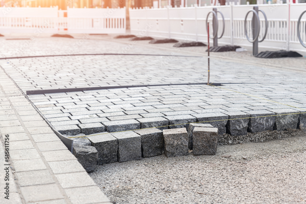 Construcion site of pavement granite cobblestone road in old city ...