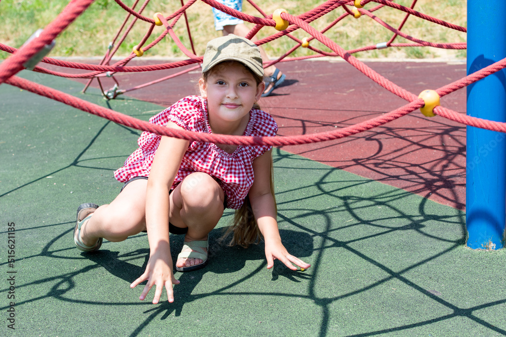 Cute teenage girl in the rope labyrinth kid park attraction Stock Photo ...