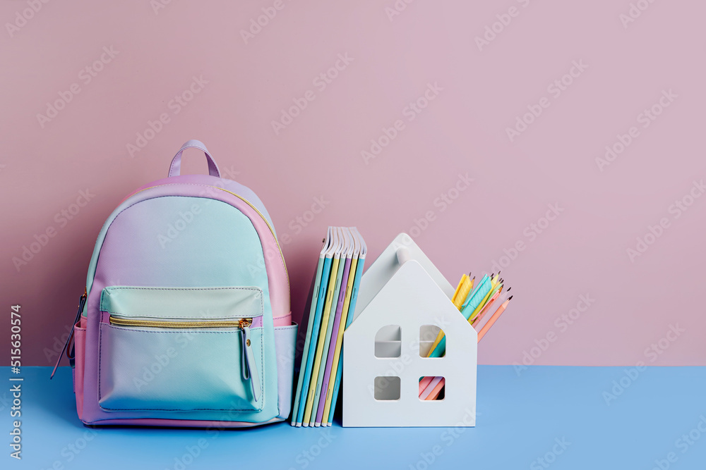 School backpack and House shaped pencil holder with color pencils and ...