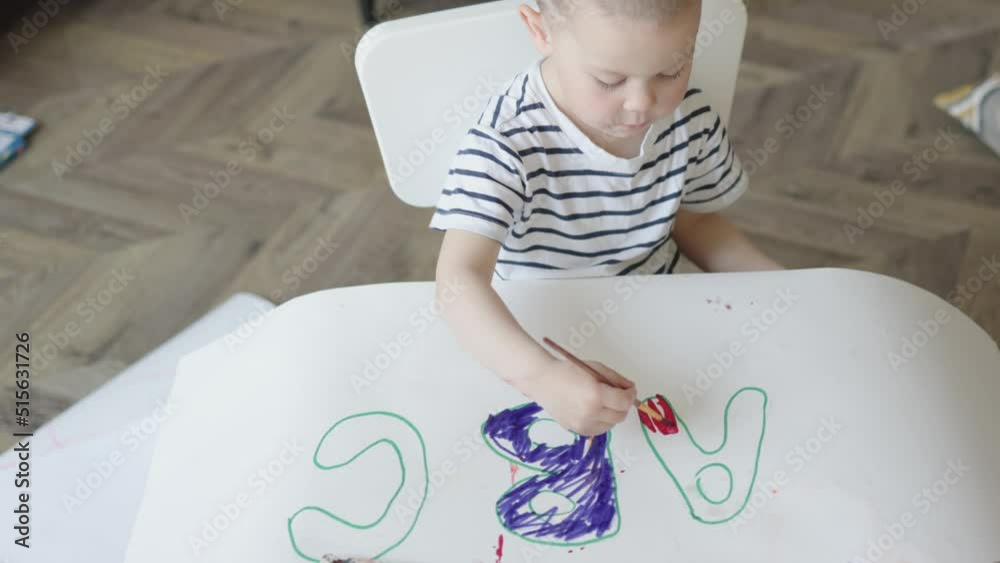 back to school concept child kid boy coloring ABC letters writings ...