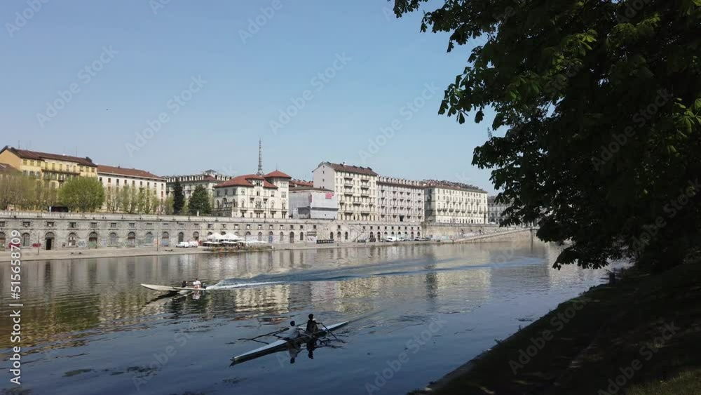 Row of houses at the waterfront of Po river in Turin, Italy - Pan from ...